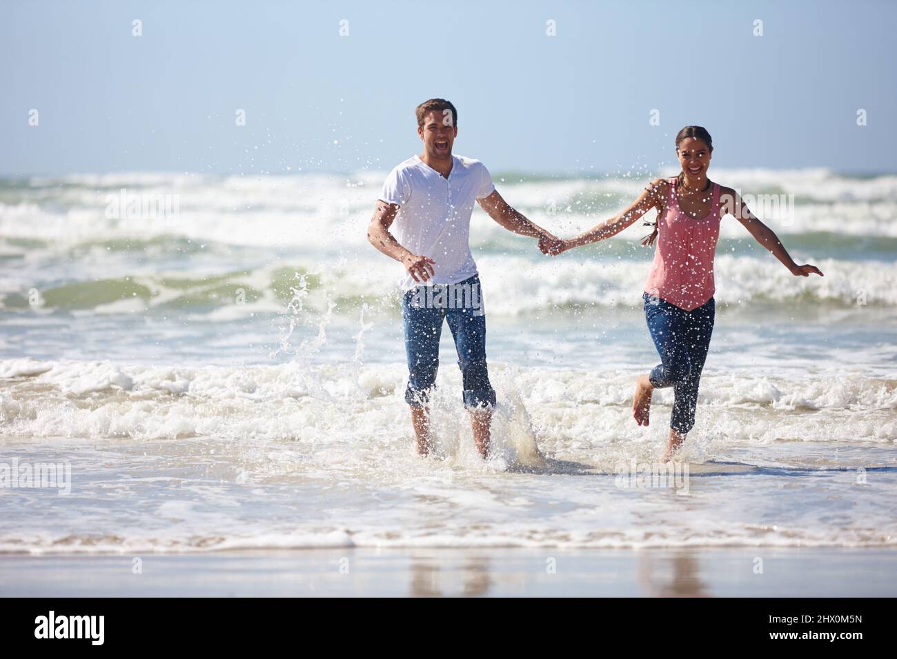 Man woman beach playful two people hi-res stock photography and images ...