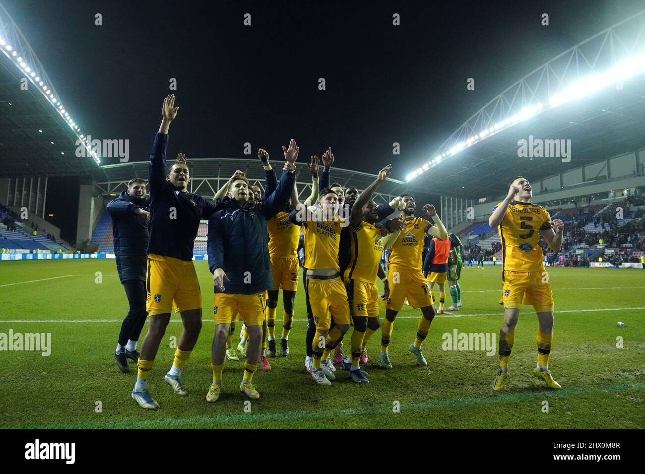 Sutton United players celebrate winning the penalty shoot-out during ...