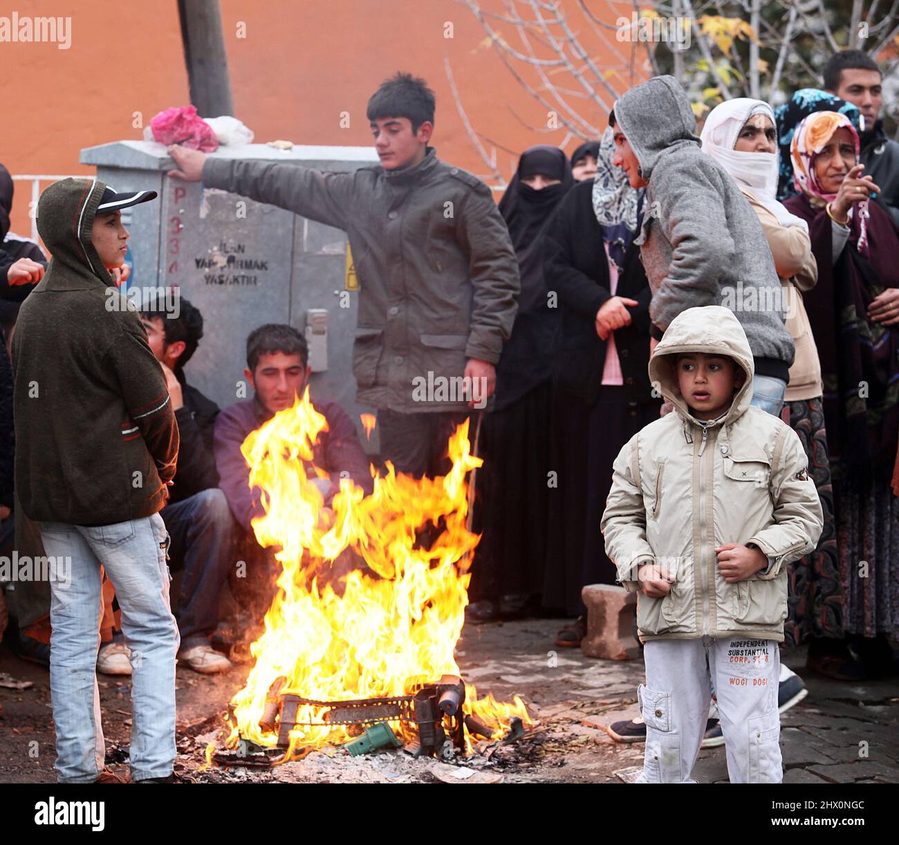VAN, TURKEY - OCTOBER 25: Earthquake victims sitting around a campfire ...