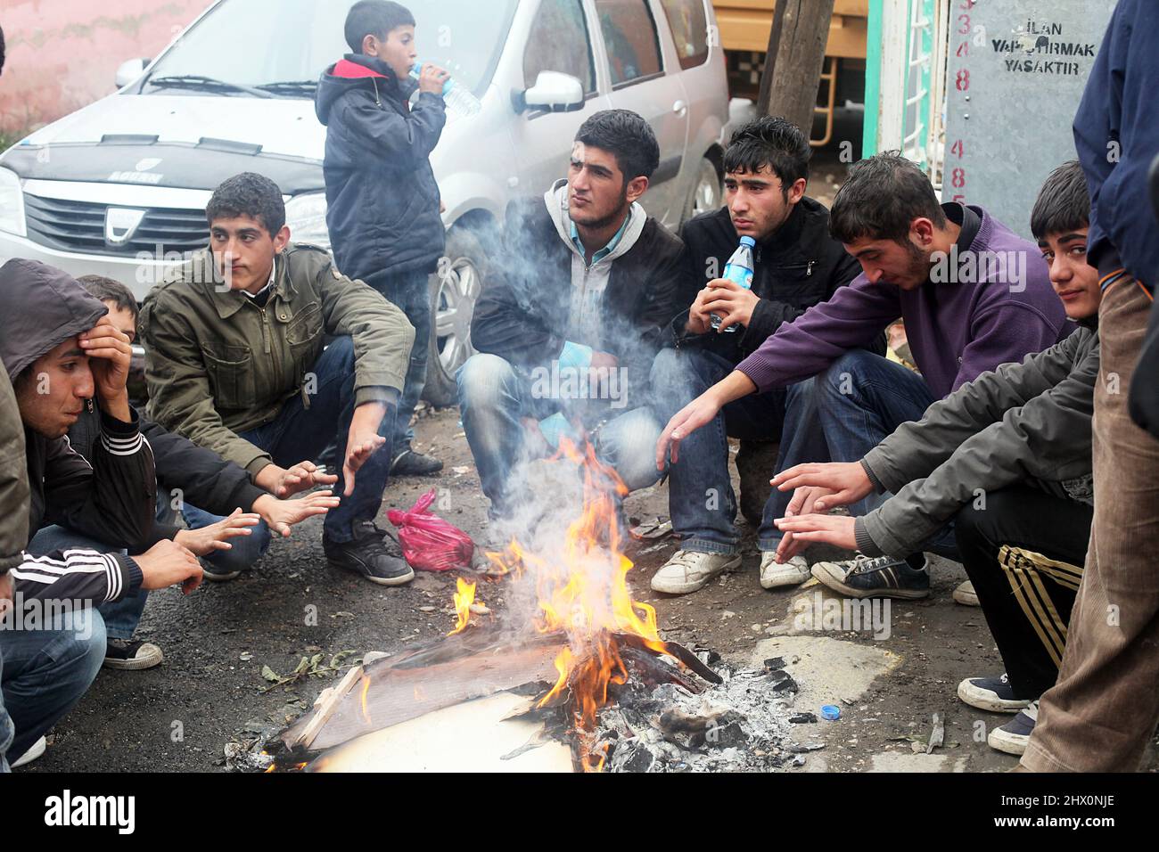 VAN, TURKEY - OCTOBER 25: Earthquake victims sitting around a campfire ...