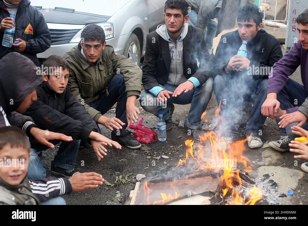 VAN, TURKEY - OCTOBER 25: Earthquake victims sitting around a campfire ...