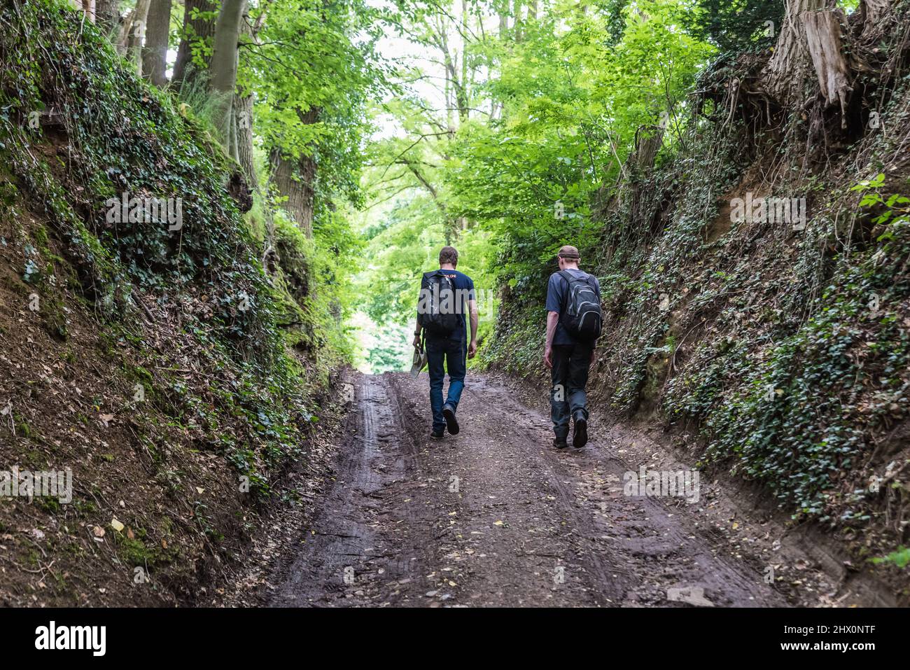 Two people walking through pathway hi-res stock photography and images ...