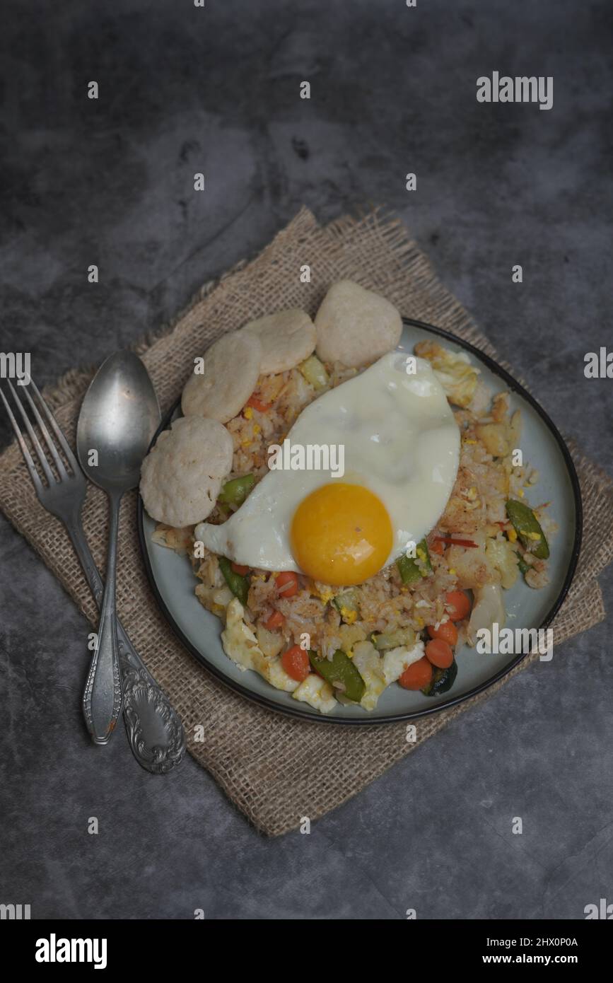 Nasi Goreng/Fried Rice served with fried egg Stock Photo - Alamy