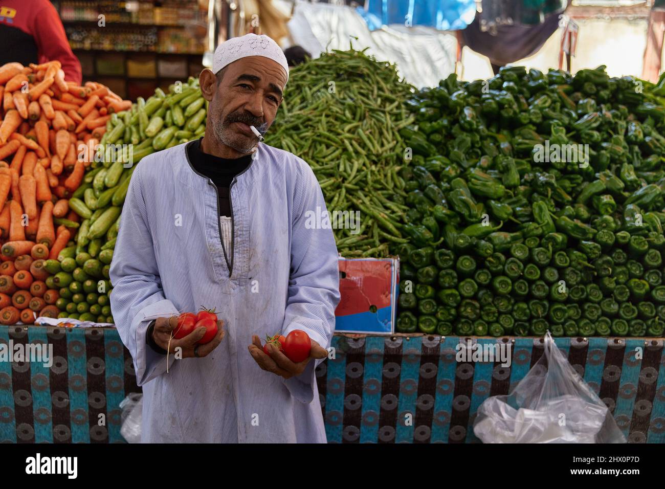 HURGHADA, EGYPT - FEBRUARY 20, 2022: Local seller standing in the ...
