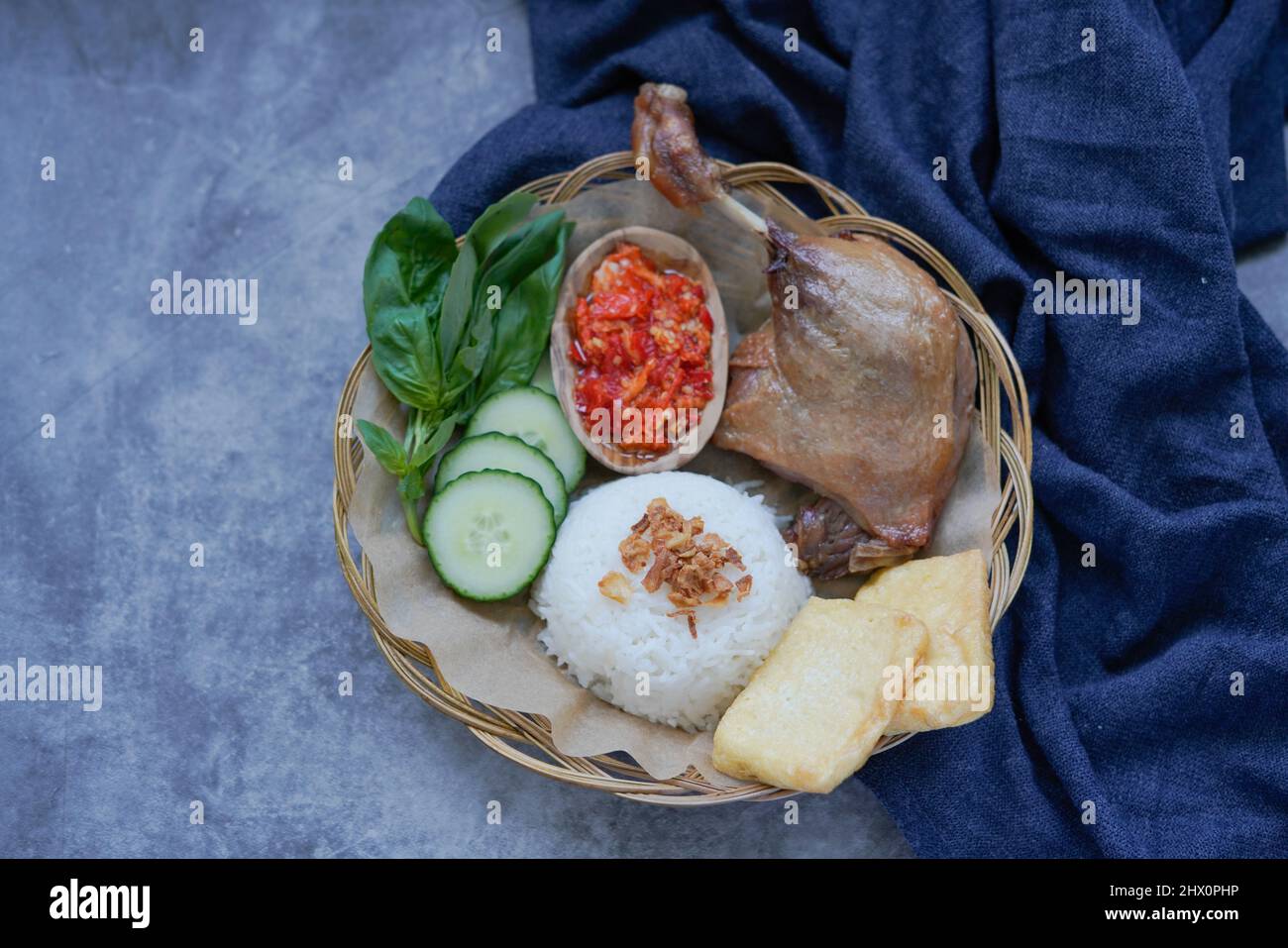 Bebek Goreng. Indonesian street food of deep-fried duck served with ...