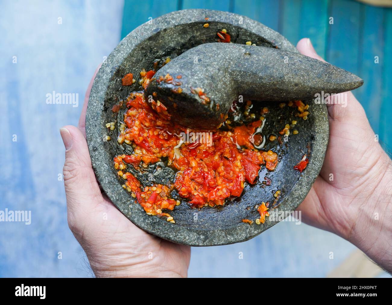 Sambal Ulek. A popular Indonesian condiment of fresh red chili peppers ...