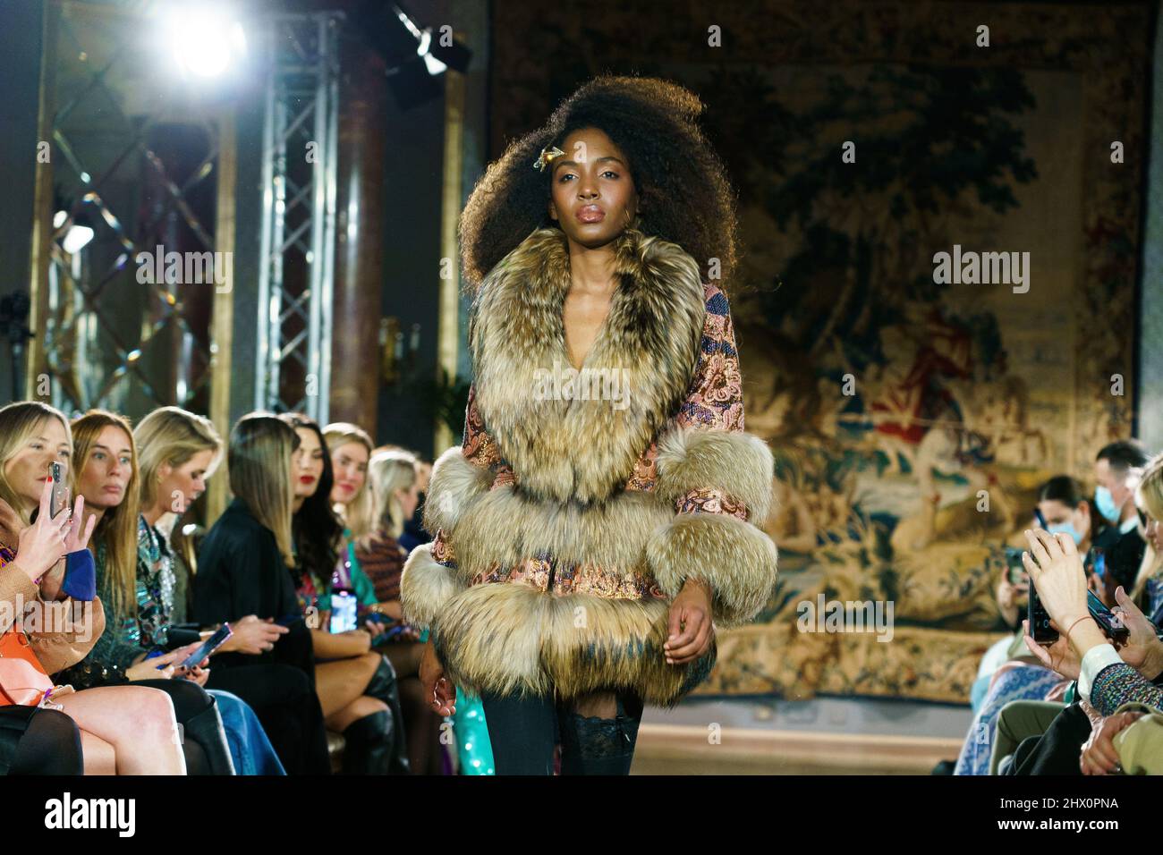Madrid, Spain. 08th Mar, 2022. A model walks the runway at the Odette ...
