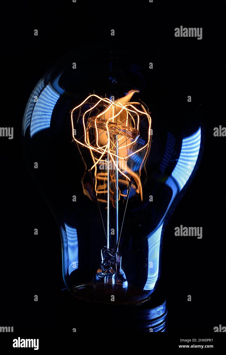 retro Edison lamp with incandescent tungsten filament close-up on a ...