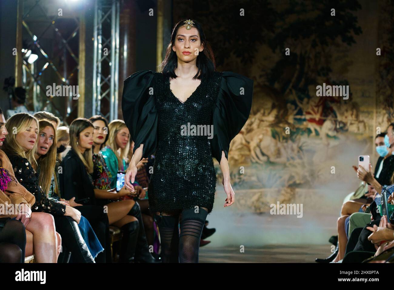 Madrid, Spain. 08th Mar, 2022. A model walks the runway at the Odette ...