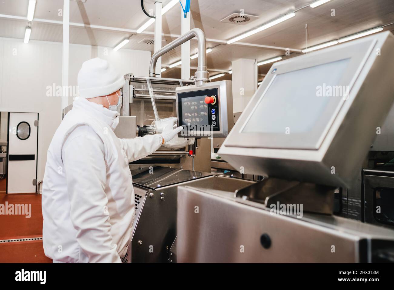 Automated production line with packaging and cutting of meat in modern ...