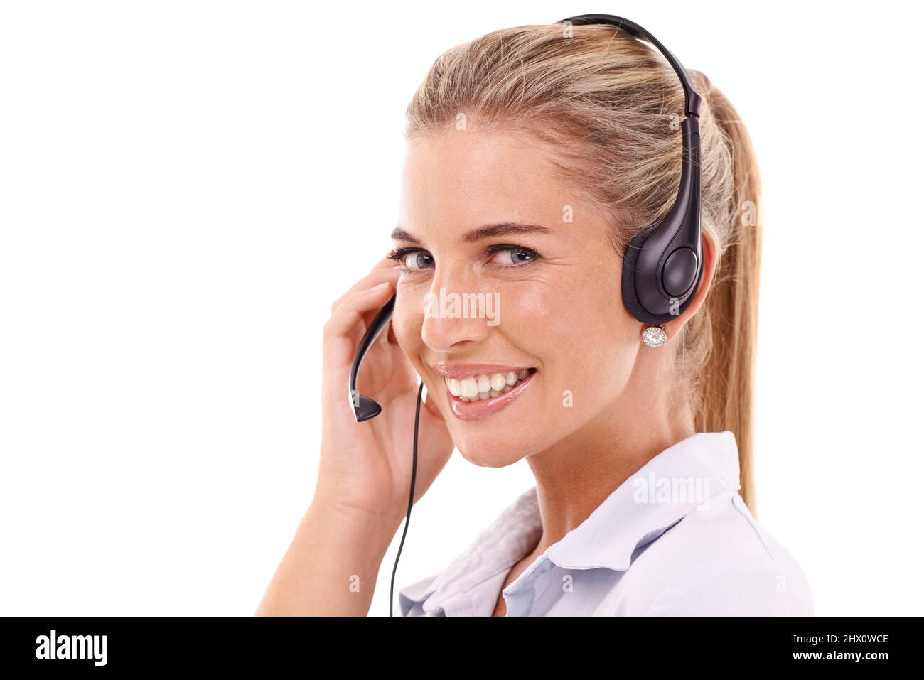 How may I help. A call centre operative speaking over her headset while ...
