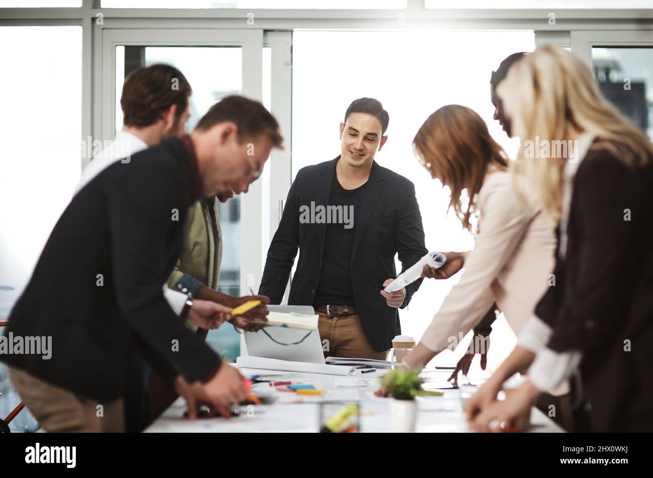 Concluding another informative meeting. Shot of a group of ...