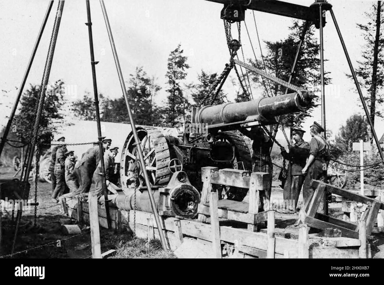 A new barrel is lowered into position on an 8 inch howitzer by the Army ...