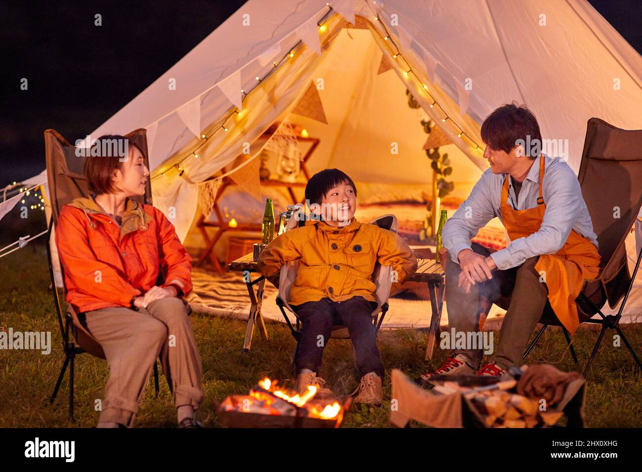 Japanese Family Over A Bonfire Stock Photo - Alamy