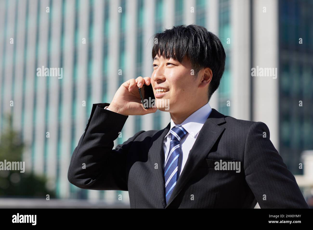 Japanese Businessman Making A Call Stock Photo - Alamy