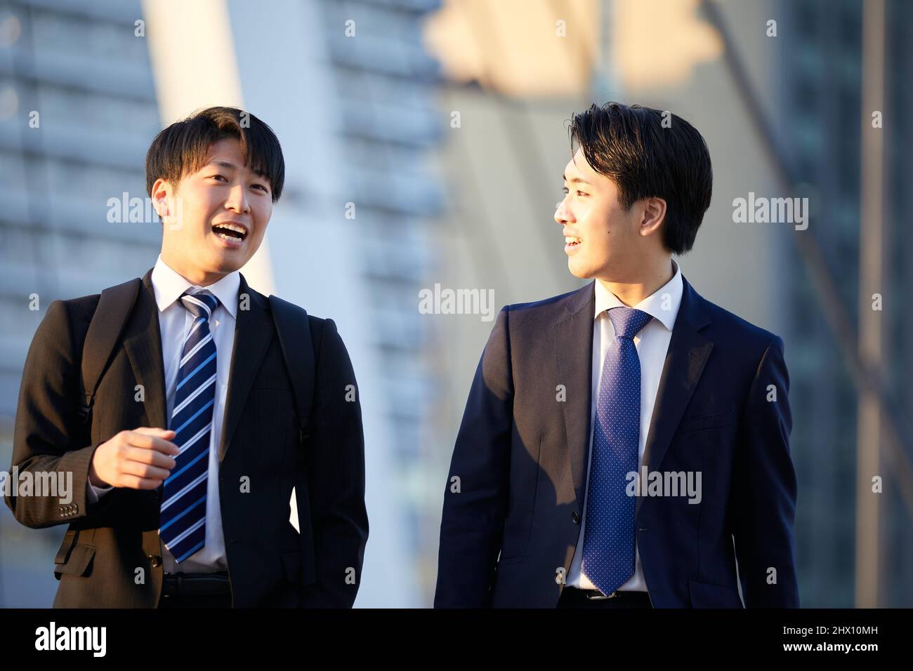 Young japanese businessmen walking hi-res stock photography and images ...
