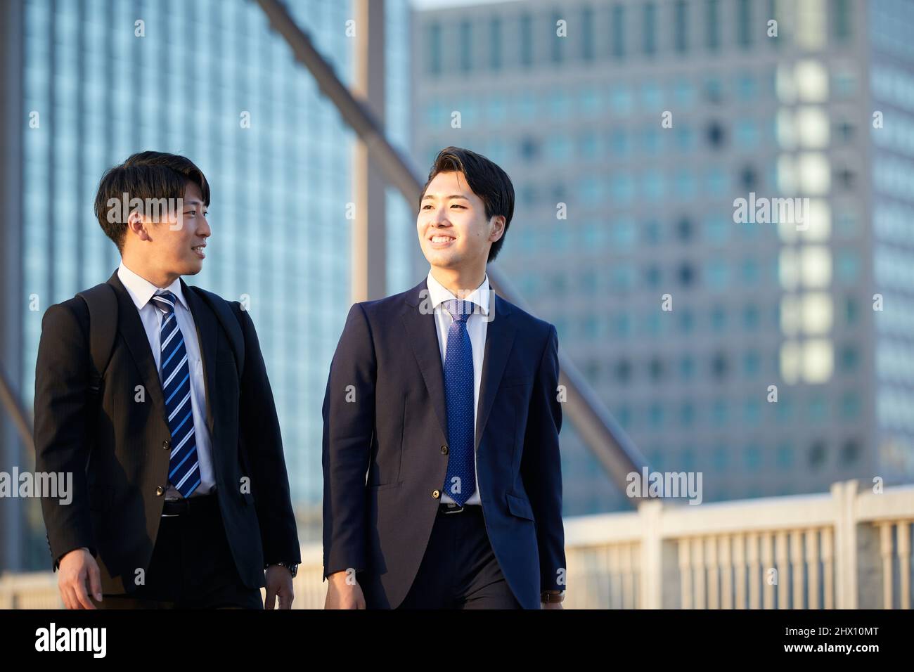 Young japanese businessmen walking hi-res stock photography and images ...