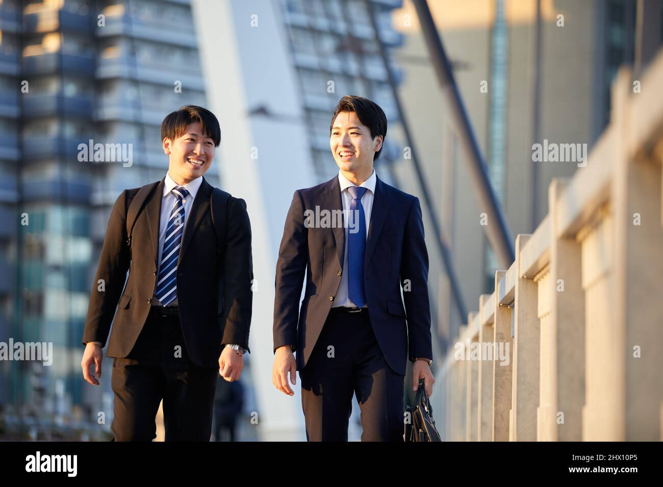 Young japanese businessmen walking hi-res stock photography and images ...