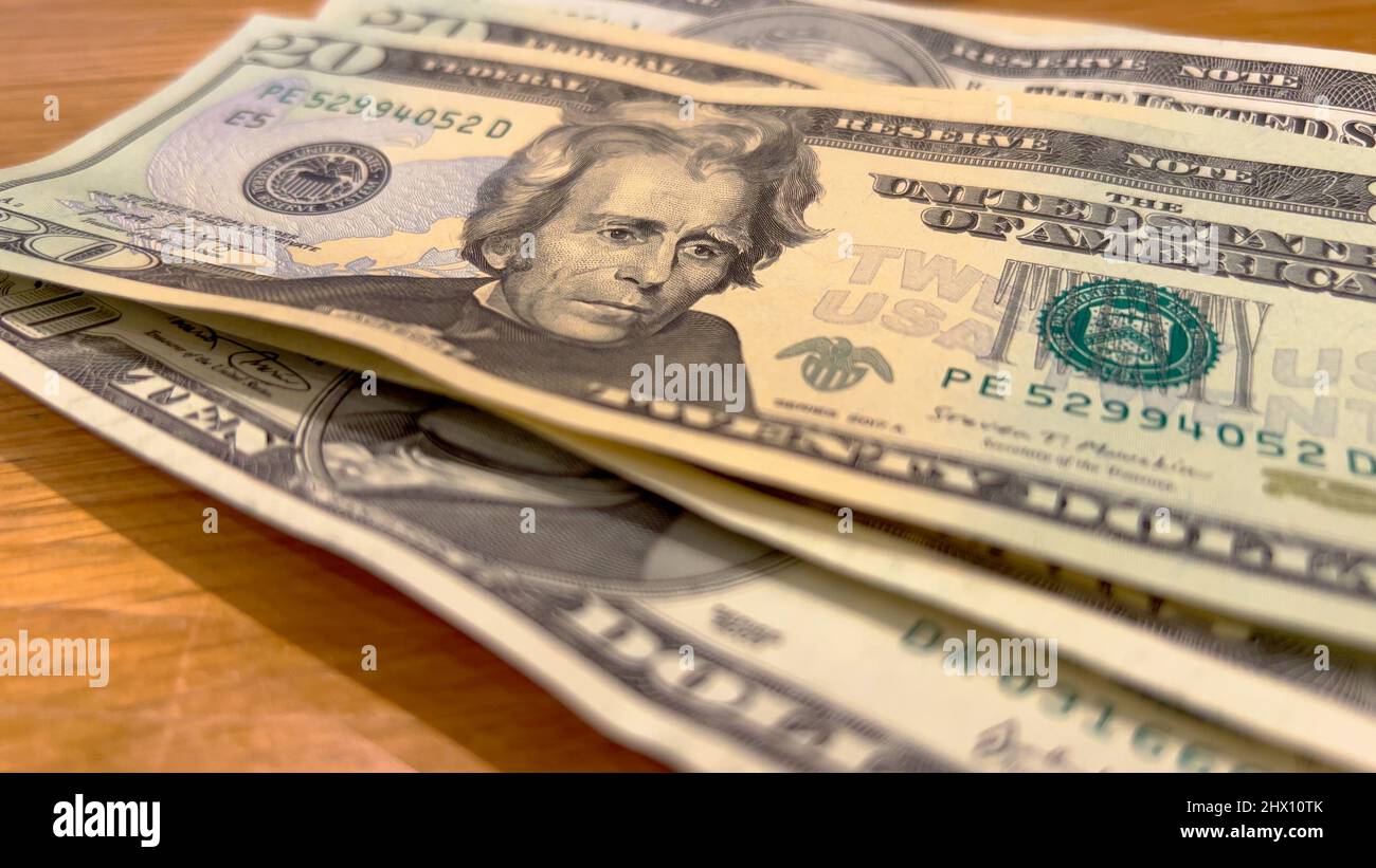 Counting a bunch of Dollar bills on a table Stock Photo - Alamy
