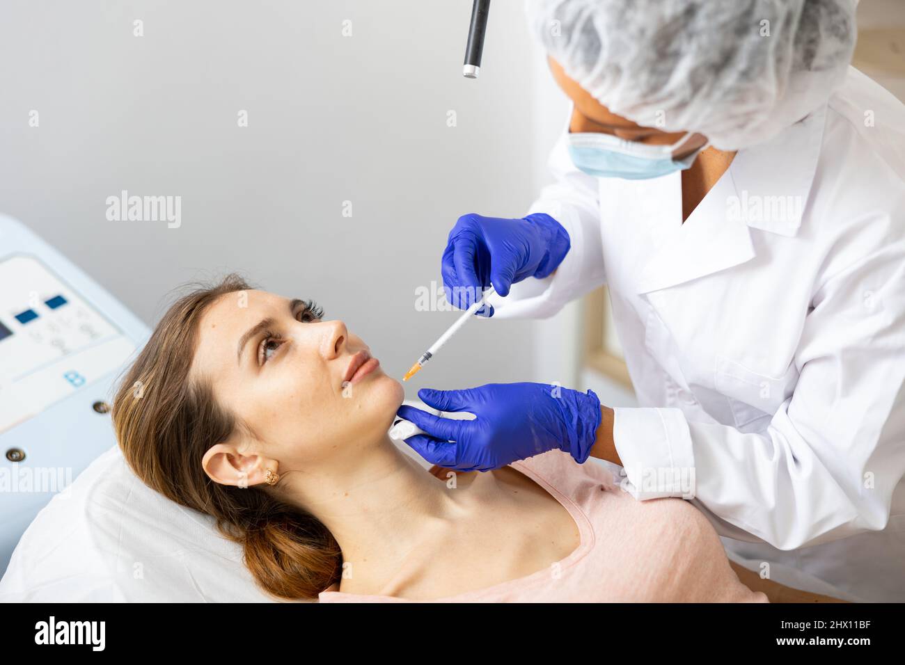 Woman receiving cosmetic facial injection at clinic Stock Photo - Alamy