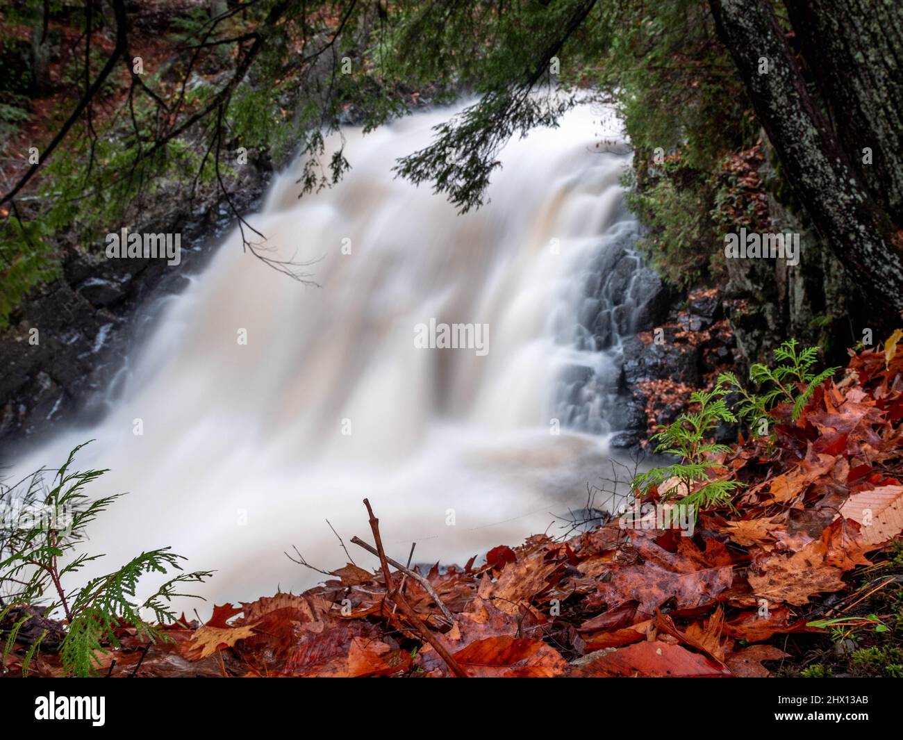 A powerful waterfall in beautiful autumn colors Stock Photo - Alamy