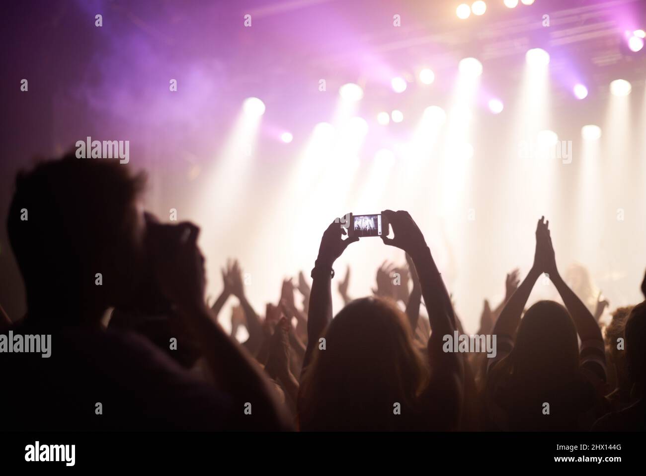Filming at concert hi-res stock photography and images - Alamy