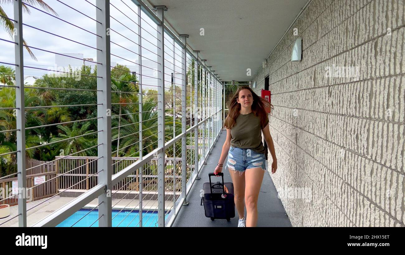 Young woman checks in at a Motel Stock Photo - Alamy