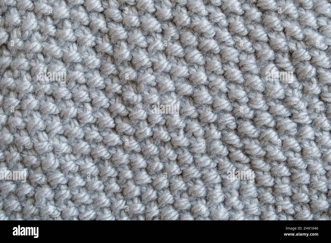 Grey knitted fabric hi-res stock photography and images - Alamy