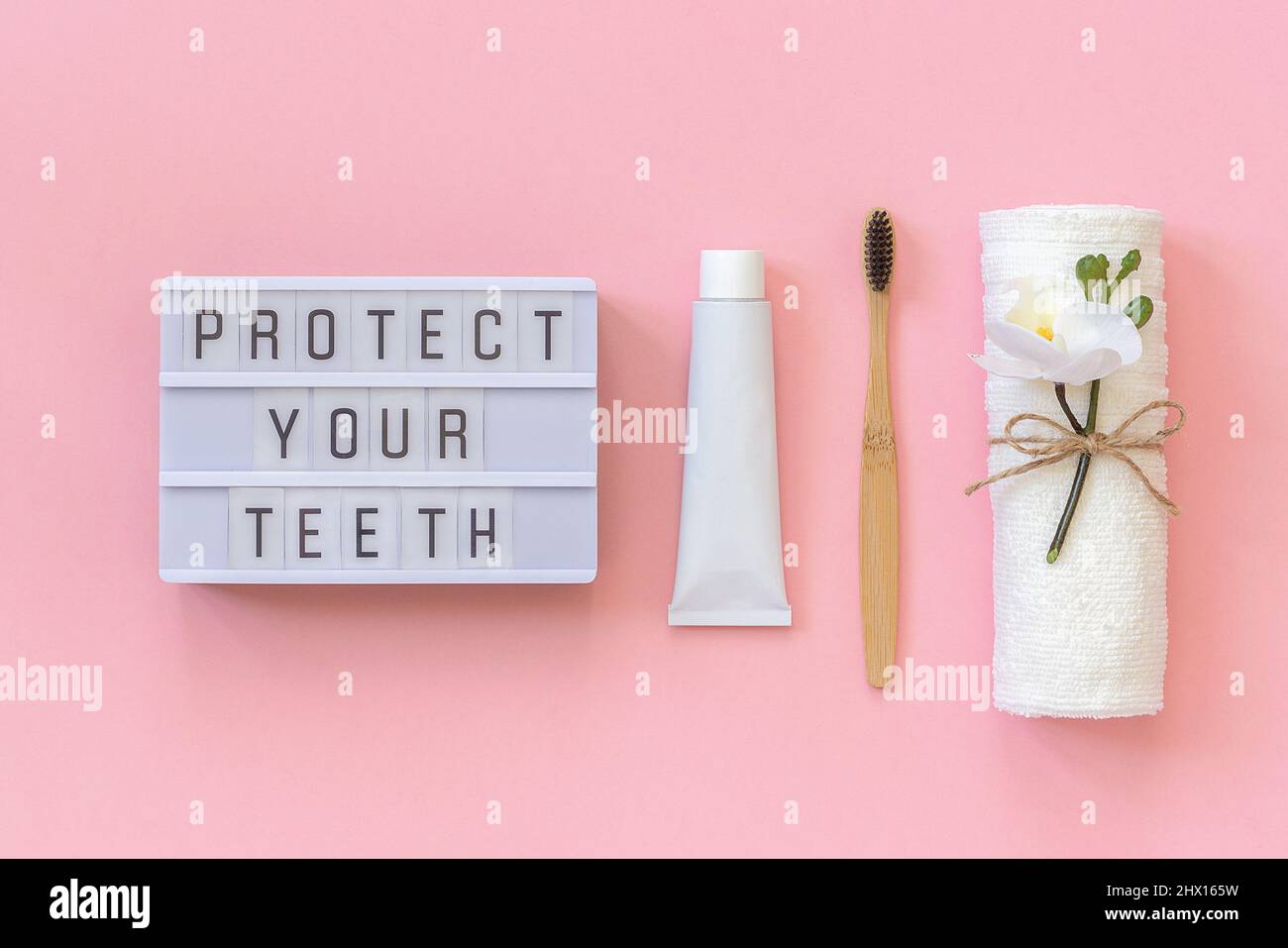 Protect your teeth text on light box and natural eco-friendly bamboo ...