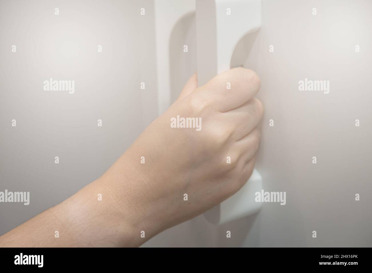 Woman hand open wardrobe use for background Stock Photo - Alamy