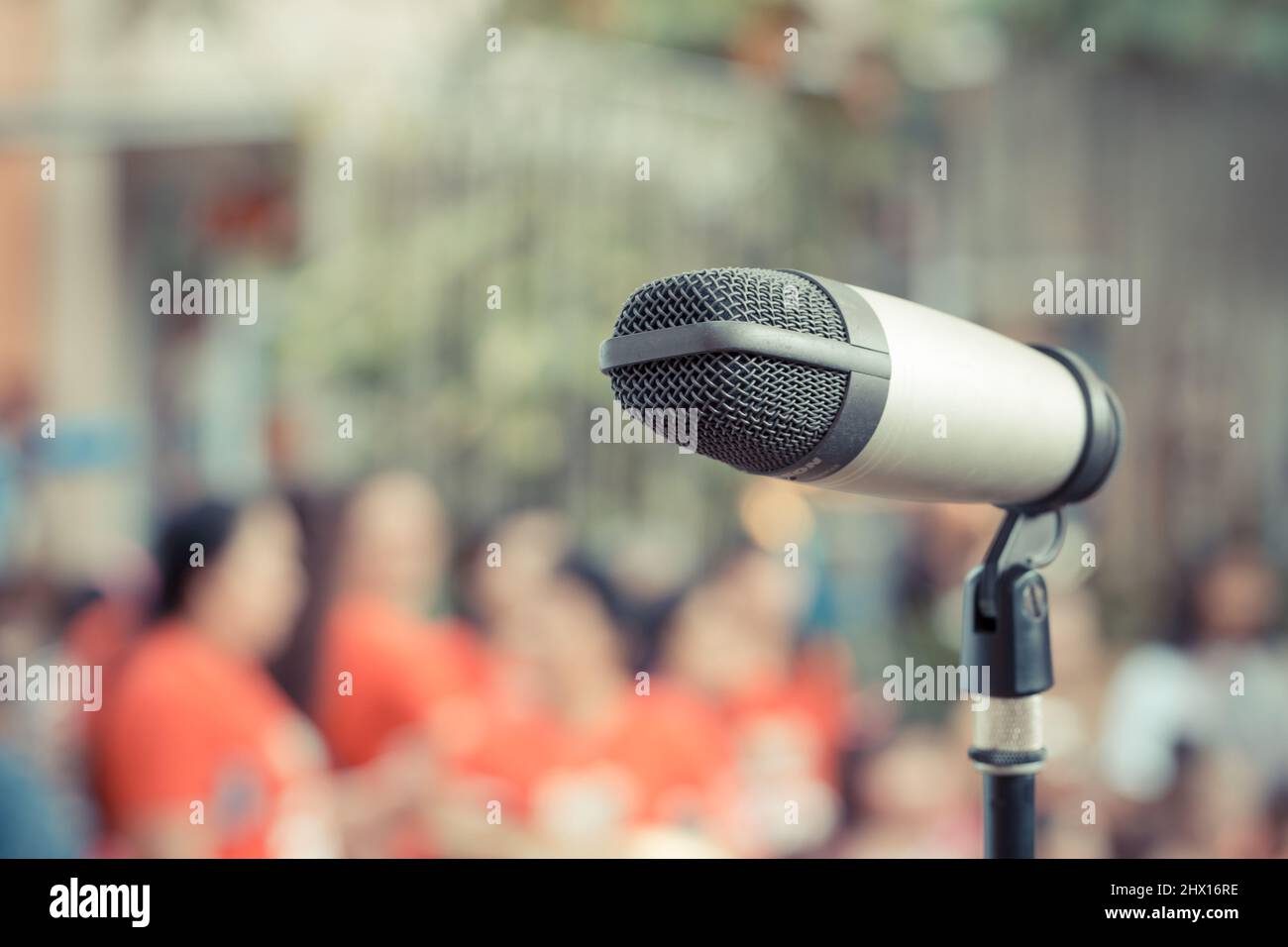 Close up of microphone in public place with blur background Stock Photo ...