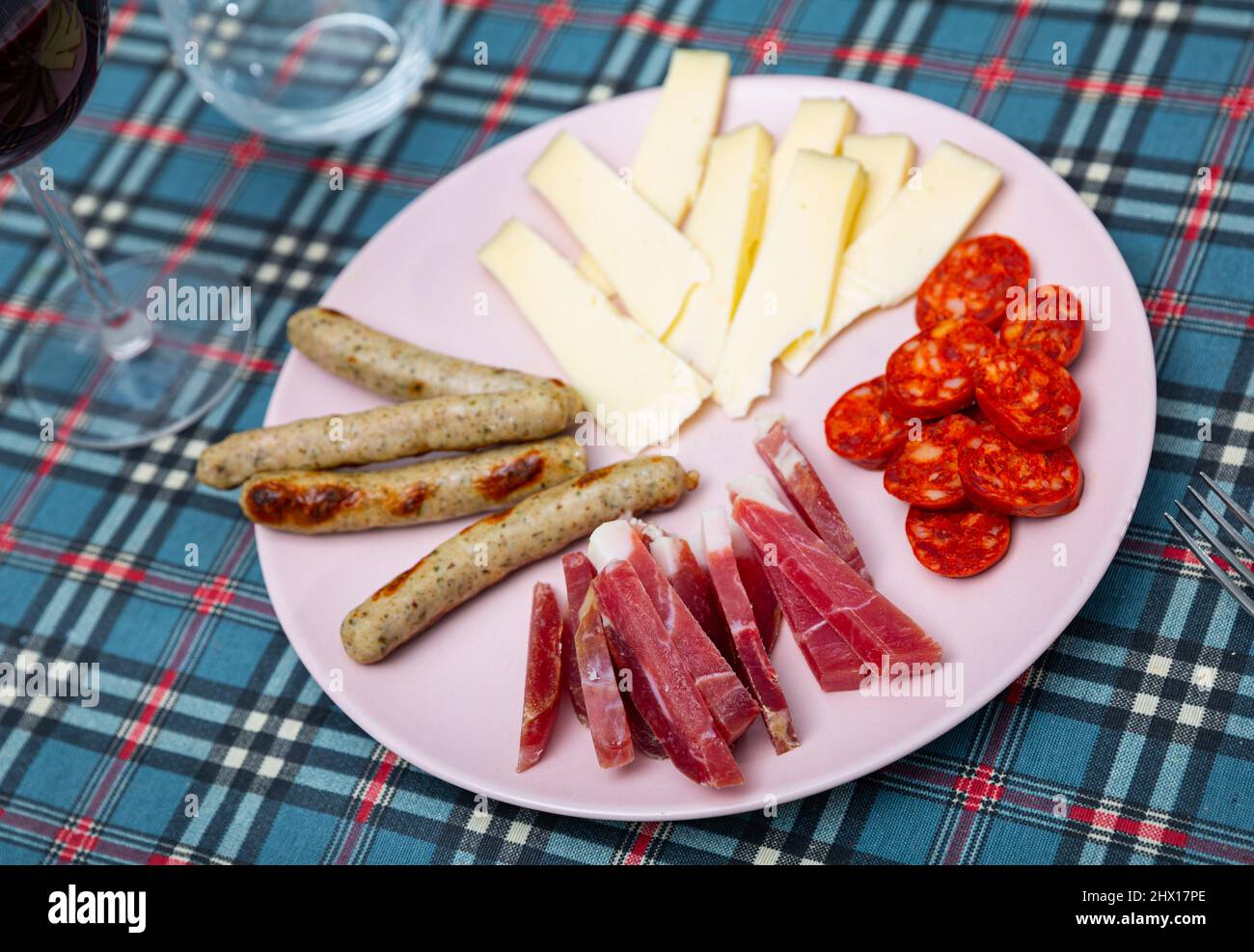 Traditional spanish snack tapas on a plate Stock Photo - Alamy