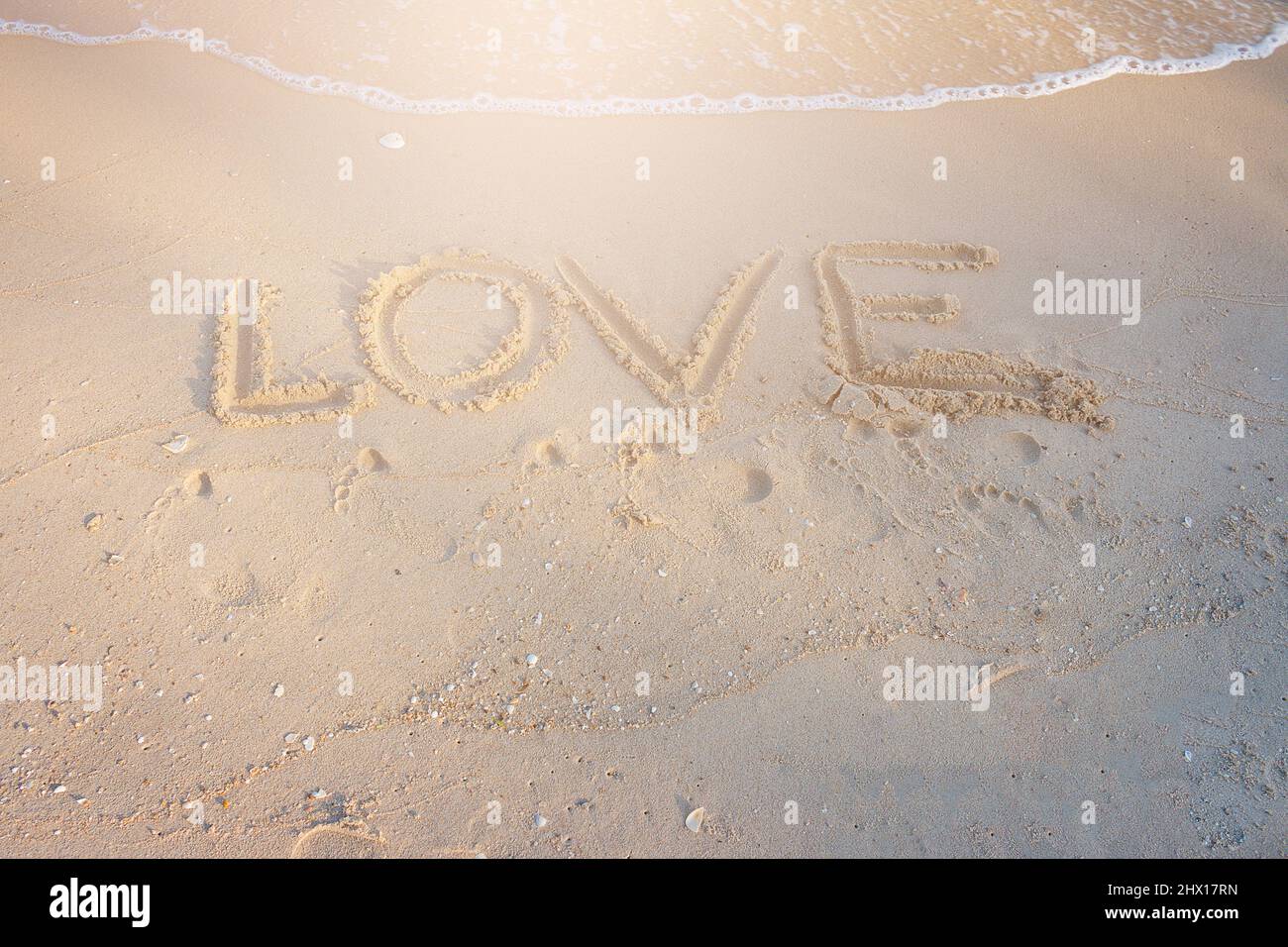 love message written in sand background Stock Photo - Alamy