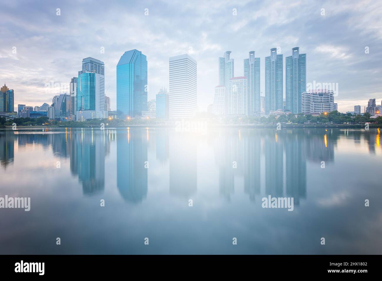 City building with water reflection before sunset background Stock ...