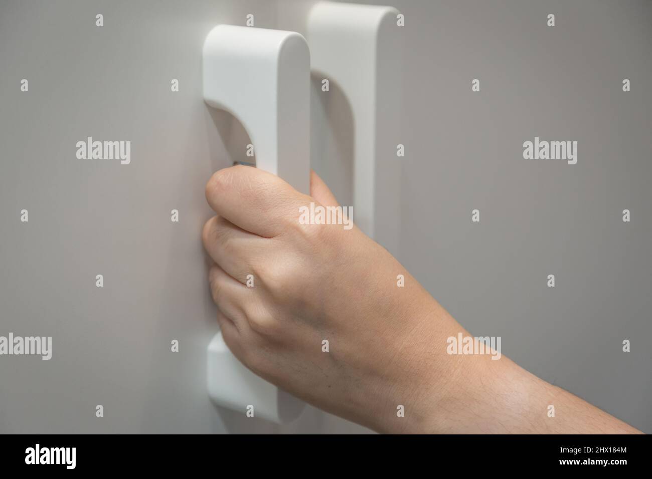 Woman hand open wardrobe use for background Stock Photo - Alamy