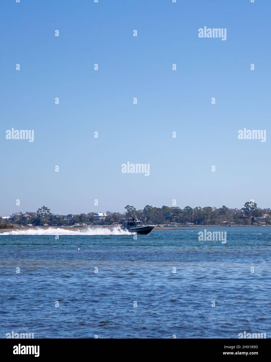 A United States Coast Guard vessel acting as a simulated enemy vessel ...