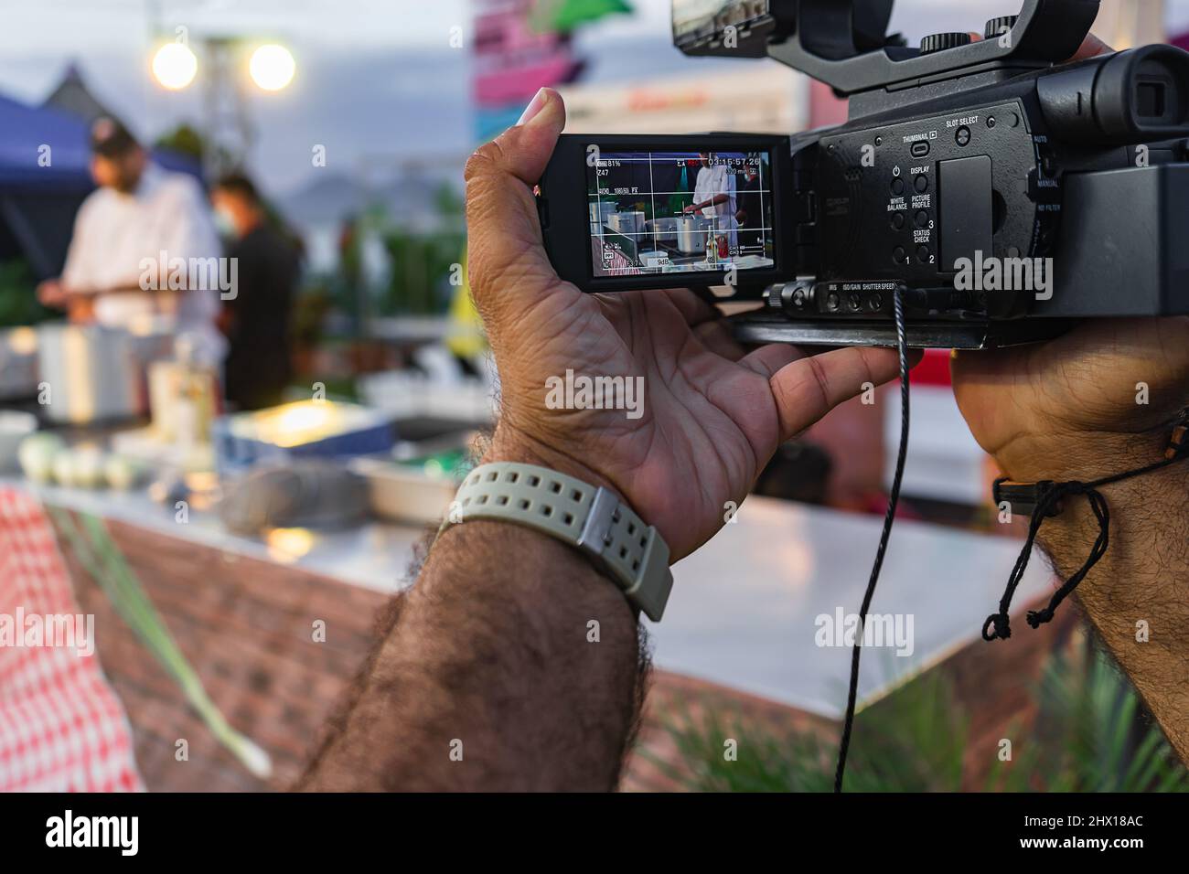 A cameraman makes footage and broadcasts a cooking show on tv Stock ...