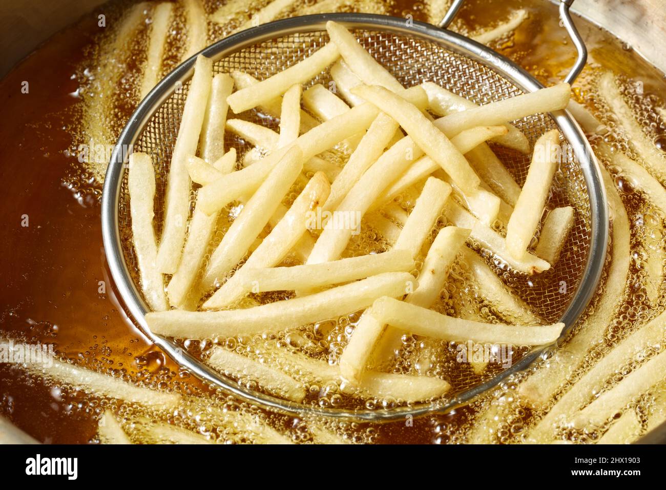 Scooping fries hi-res stock photography and images - Alamy