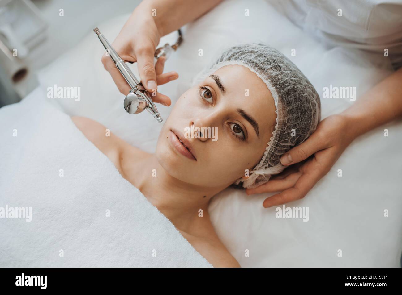 Womans face getting procedure of facial oxygen therapy with apparatus ...