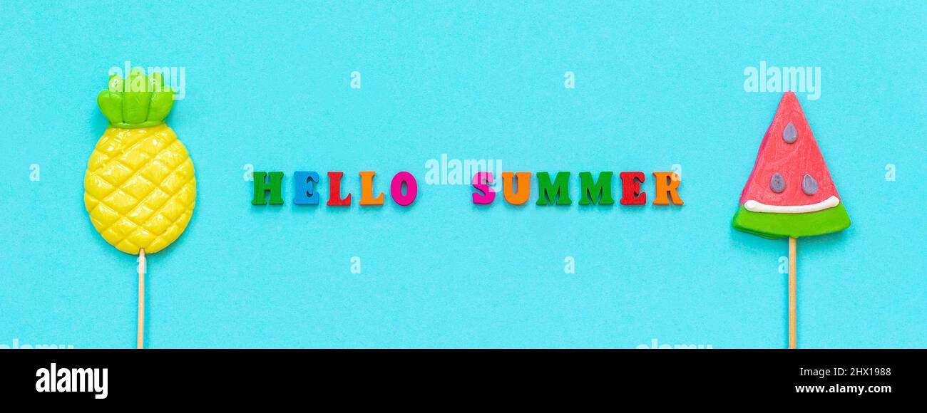 Hello summer colorful text, pineapple and watermelon lollipops on stick ...