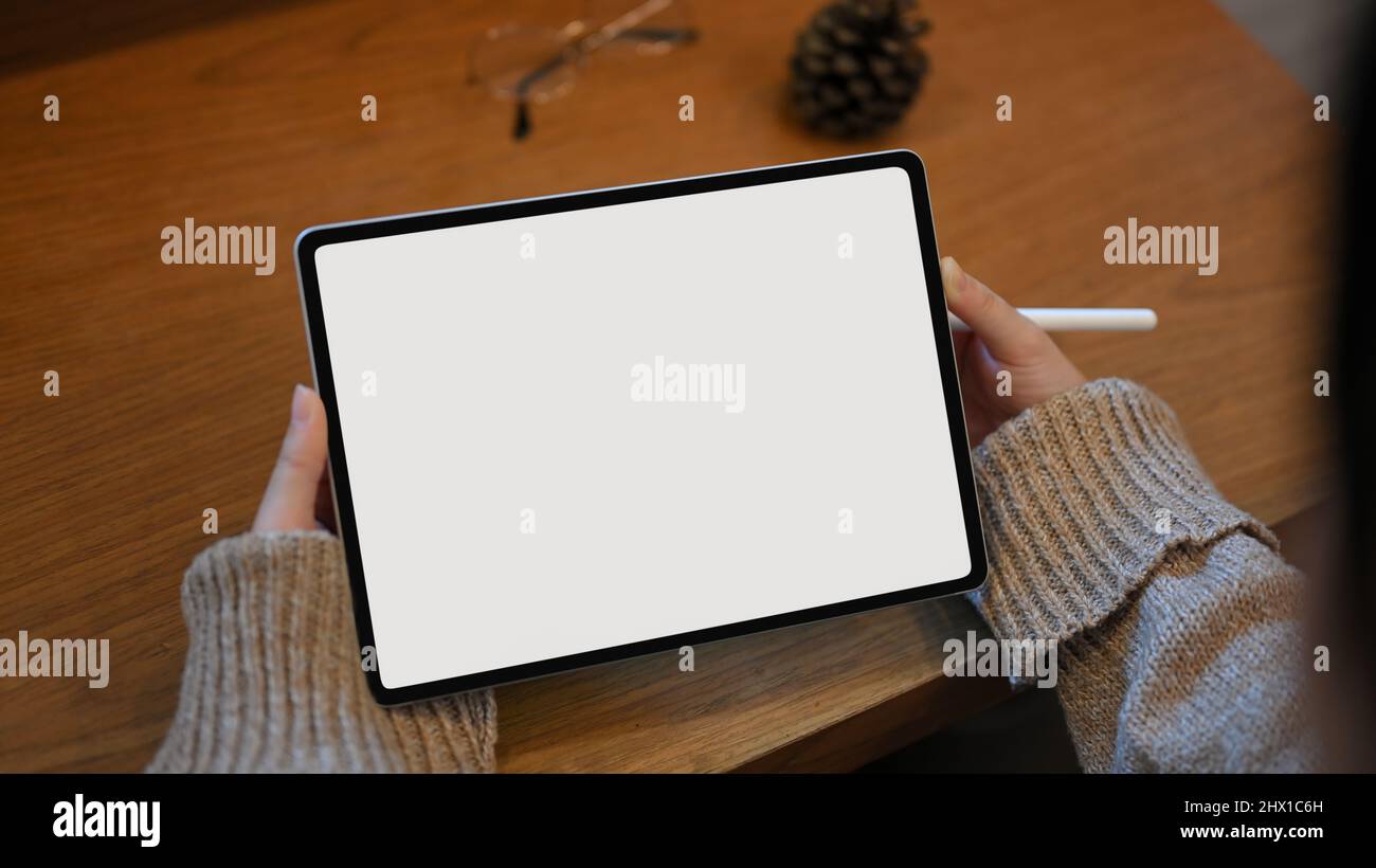 Overhead shot, Young woman hands holding digital tablet computer and ...
