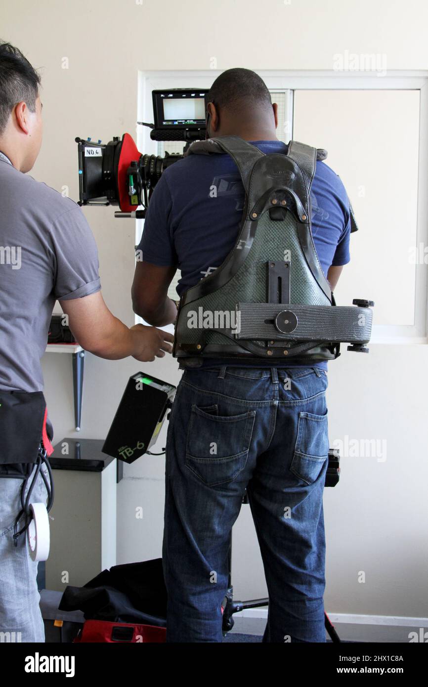 Filming cinema scene crew in action Stock Photo - Alamy