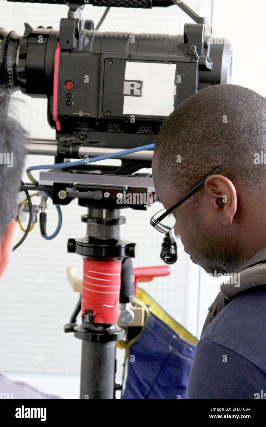 Filming cinema scene crew in action Stock Photo - Alamy