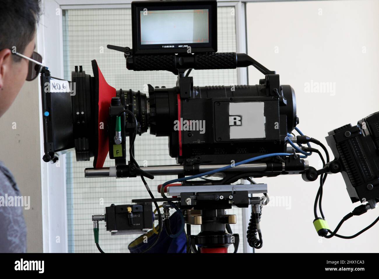 Filming cinema scene crew in action Stock Photo - Alamy