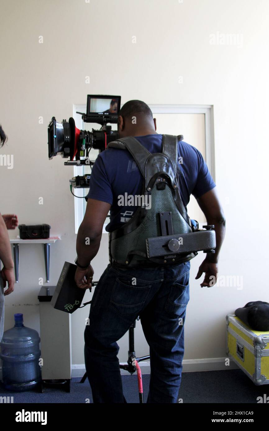 Filming cinema scene crew in action Stock Photo - Alamy