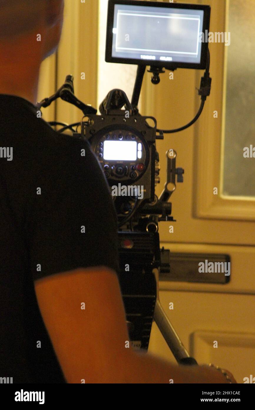 Filming cinema scene crew in action Stock Photo - Alamy
