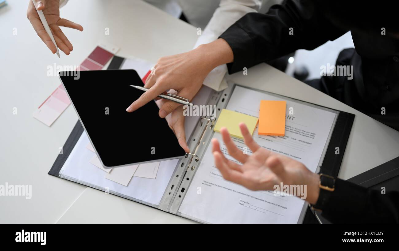 Cropped, overhead shot, Business management team pointing their finger ...
