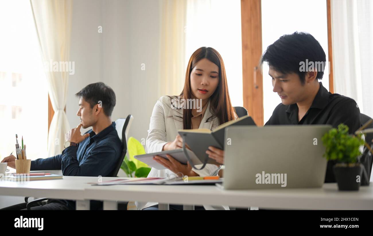 Female Asian employee working and planning the marketing project with ...