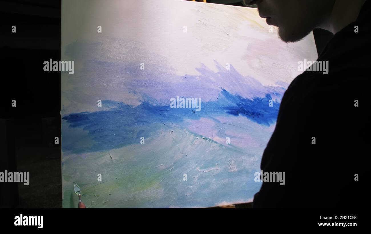 Artist copyist paint seascape with ship in ocean. Craftsman decorator ...