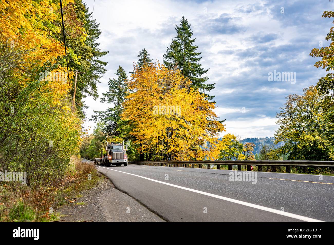 Powerful classic big rig industrial semi truck with oversize load sign ...
